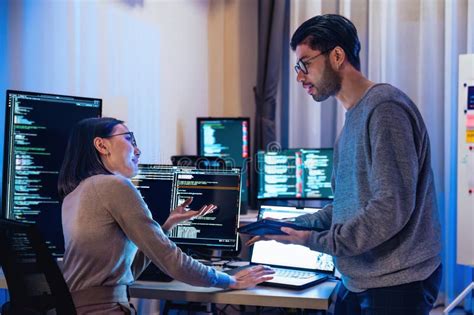 Asian And Indian Developer Devops Team Discussion About Coding Promgram