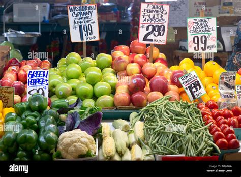 A Vendor Displays Her Food Produce At The Pike Place Public Market In