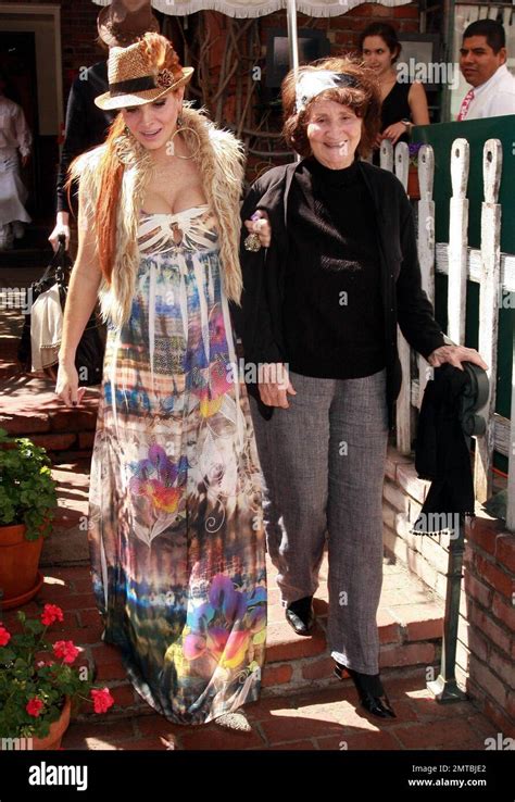 Phoebe Price Strikes A Seductive Pose As She Shows Off Her Lunch While Eating With Her Mother At