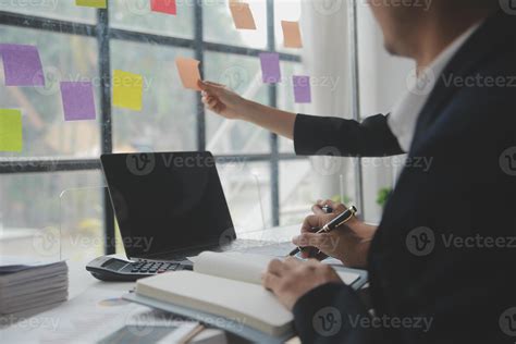 Business Professionals Group Of Young Confident Business People Analyzing Data Using Computer