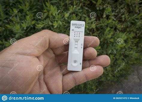Hand Holding A Positive Rapid Antigen Test Card For Covid19 Editorial