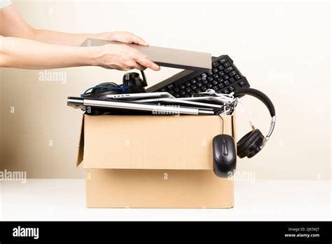 Woman Hands Put Old Laptop Computer In Cardboard Box Full Used Computers And Gadget Devices For