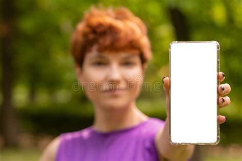 Non Binary Person Showing Smartphone In Park Stock Image Image Of
