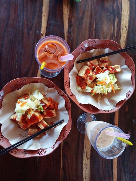 Close Up Of Delicious Stinky Tofu Stinky Tofu With Fresh Pickled Radish On Brown Plate Stock