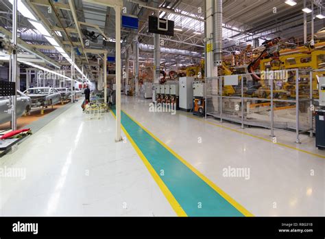 Workers Assemble A Vehicle Body Process Of Welding Cars Modern