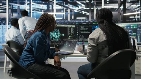 Data Center Engineer Using Tablet To Interpret Ai Generated Data Analytics Graphs Stock Footage