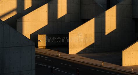 Modern Architecture With Concrete Walls And Dramatic Shadows In Golden Hour Stock Image Image