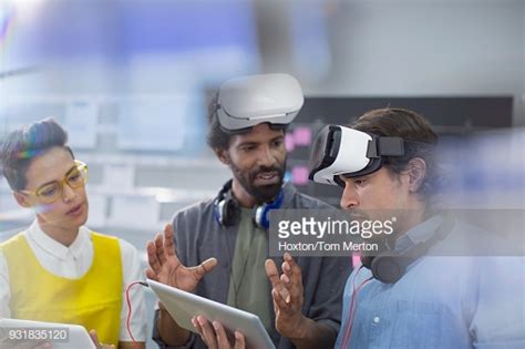 Computer Programmers With Digital Tablet Programming Virtual Reality Simulators Atlona® Av