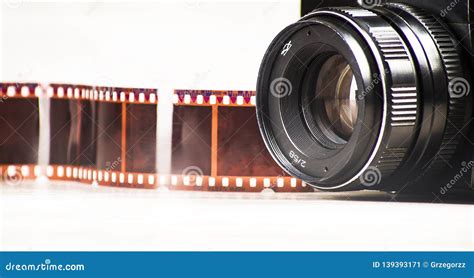 Concept Of Analog Photography Camera On The Background Of Negatives