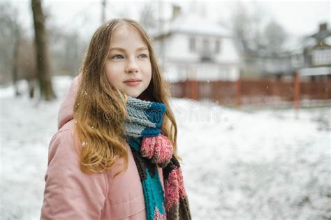 Cute Teen Girl Having Fun On A Walk In City Park On Chilly Winter Day