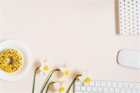 Premium Photo Womens Office Desk With Flowers A Female Workplace With A Keyboard Mouse Notepad