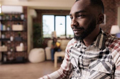 Closeup Of African American Freelancer Reading Content On Computer