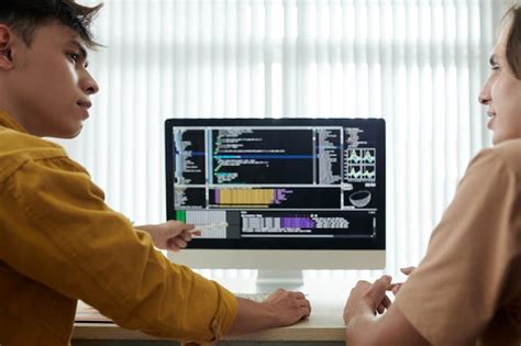Premium Photo Man Explaining Programming Code To Friend