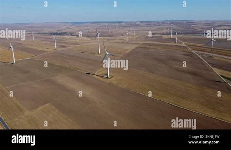 Rotating Wind Turbines On Wind Farm Drone Ascending Shot Reveals Open Stock Video Footage Alamy
