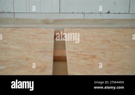 The Process Of Installing A Subfloor From Oriented Strand Board In A