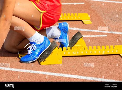 Athletes Debugging Run Up Ware On Plastic Runway In A Middle School