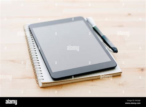 Studio Shot Of Digital Tablet Spiral Notebook And Ballpoint Pen Stock Photo Alamy