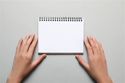 Premium Photo Female Hands And Blank Notebook On Light Gray Background