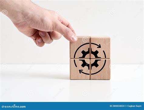 Business Productivity And Production Process Optimization Hand Places Wooden Cubes With