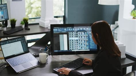 Premium Photo Engineer Developing 3d Building Model On Graphic Software