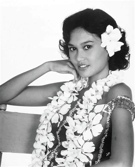 Black And White Pic Of Tia Carrere With A Flower In Her Hair Scrolller