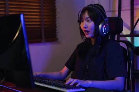 Premium Photo Female Cyber Hacker Gamer In Headphone Excited While Playing Games Or Hacking
