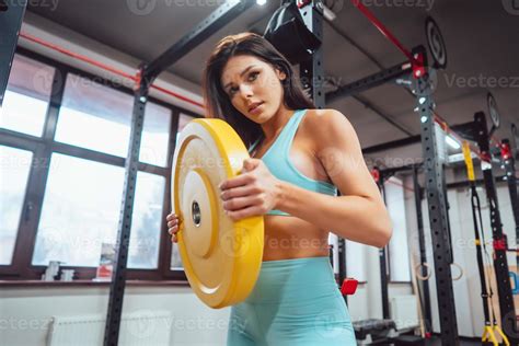 Young Adult Girl Doing Strength Exercises In The Gym 11339671 Stock