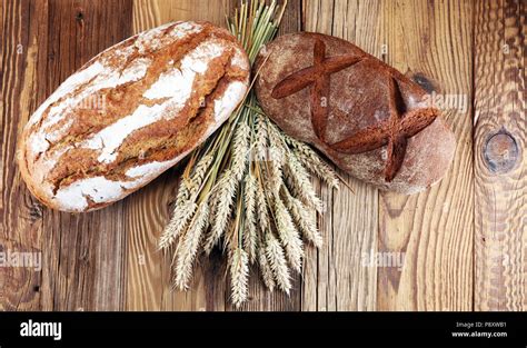 Different Kinds Of Bread And Bread Rolls On Board From Above Kitchen