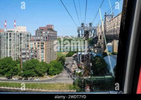 Roosevelt Island Tramway Aerial View Of A Tram Car Passing East 60th