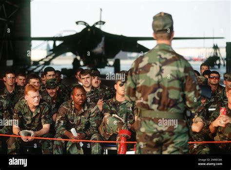 Members Of The 48th Tactical Fighter Wing Listen To A Briefing As They