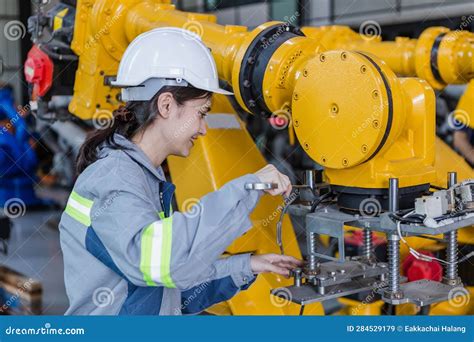 Engineers Woman Using Wrench Maintenance Robotic Arm Female Technician
