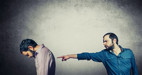 Person Pointing To Another Person
