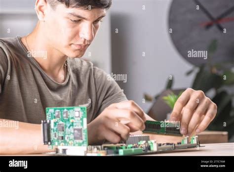 male it technician inserting ram memory computer motherboard stock