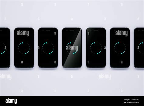 3d Rendering Of A Set Of Smartphones Displaying Sync Icons