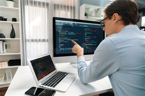 It Developer Pointing On Coding Software On Pc Comparing Laptop