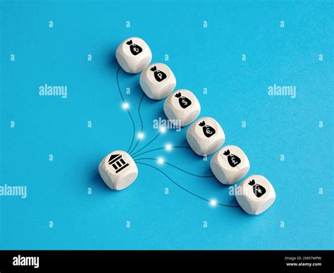 Wooden Cubes With Bank And Currency Money Bags Linked With Transfer
