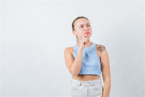 Premium Photo Blonde Girl Is Contemplating On White Background