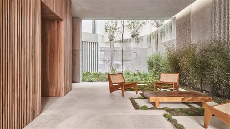Wood Screens And Green Courtyards Define Apartment Block In Mallorca By
