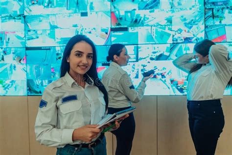 Group Portrait Of Female Security Operator While Working In A Data System Control Room Offices