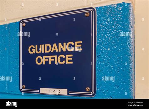 Guidance Office Counselor Office Sign With Braille On Blue Wall At Door To School Office