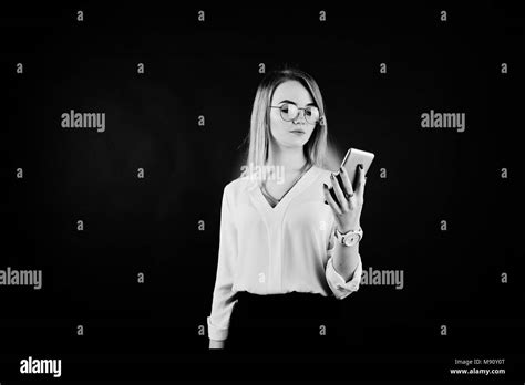 Studio Portrait Of Blonde Businesswoman In Glasses White Blouse And