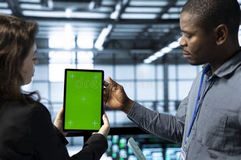 Engineers In Data Center Using Mockup Tablet Observing Analytics Stock Image Image Of