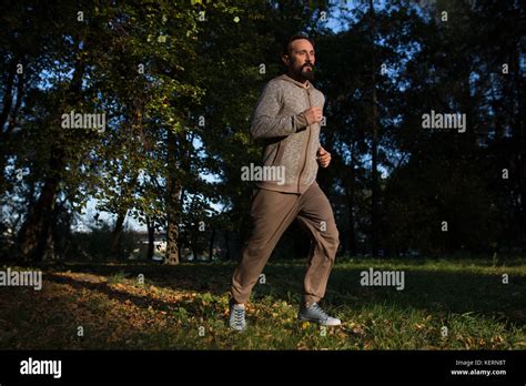 Adult Man Running In The Park Stock Photo Alamy