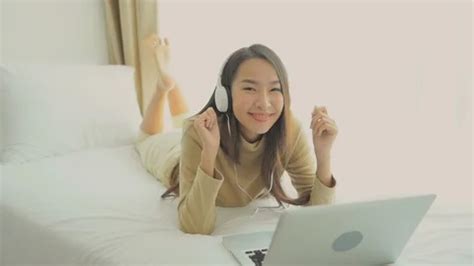 Young Asian Woman Prone On The Bed Liste Stock Video Pond5