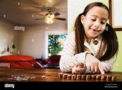 Asian Girl Counting Coins Stock Photo Alamy