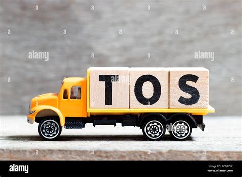 Truck Hold Letter Block In Word Tos Abbreviation Of Terms Of Service On Wood Background Stock