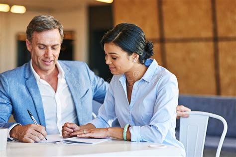Getting A Fresh Pair Of Eyes On Her Work Smiling Colleagues Working