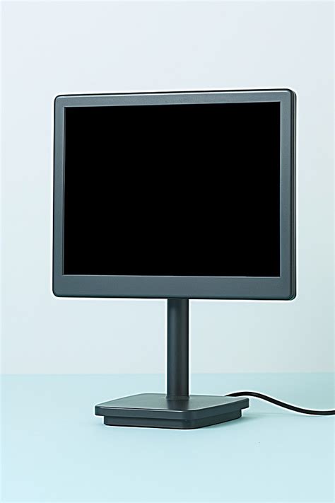 A Black Monitor Is On Stand And Facing The Camera Background Wallpaper Image For Free Download