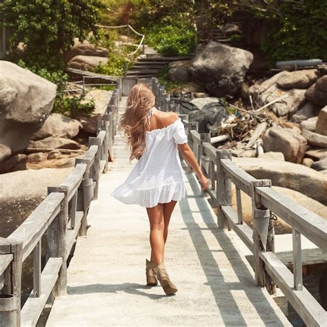 Free Photo Rear View Of Blonde Woman Walking