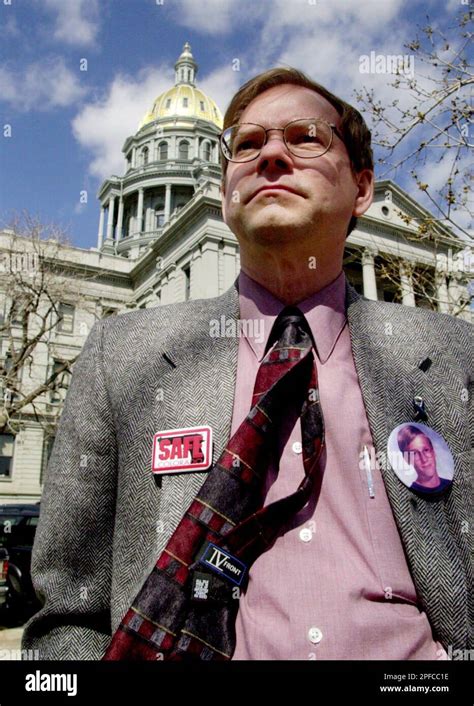 Tom Mauser Wears A Safe Button And Another Button With A Picture Of His